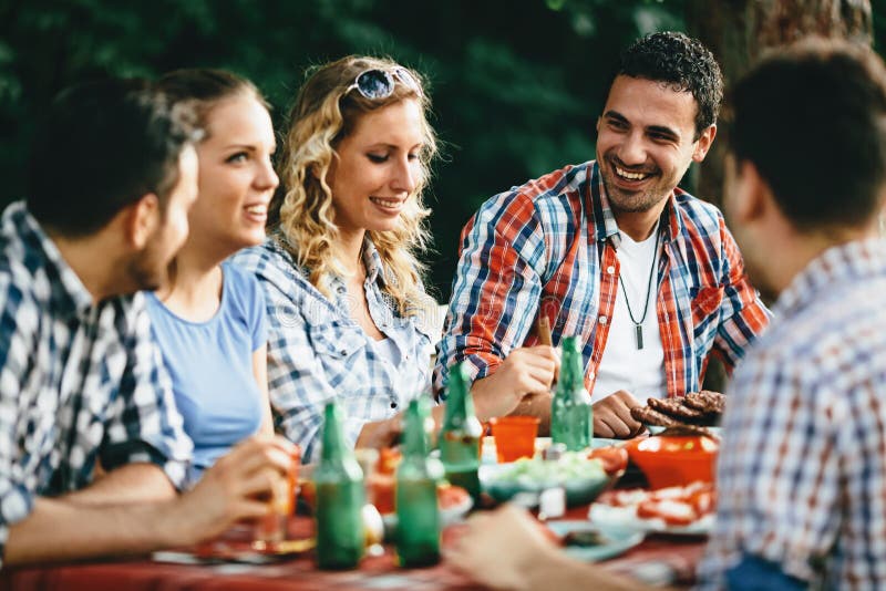 Group of Happy People Eating Food Outdoors Stock Photo - Image of enjoy ...
