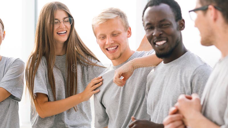 Group of Happy Young People Standing in a Bright Room Stock Photo ...
