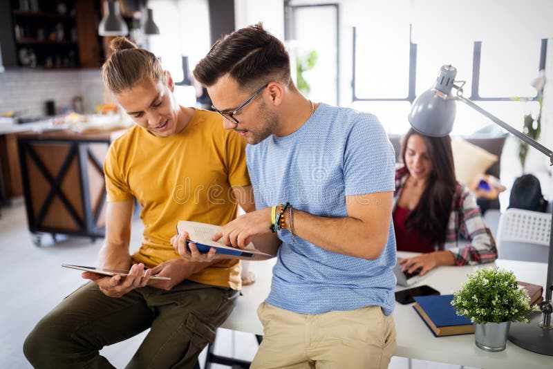 Group of Happy Young Students Having Fun while Studying Together for ...