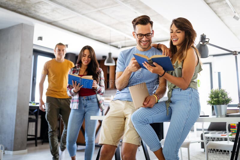 Group of Happy Young Students Having Fun while Studying Together for ...
