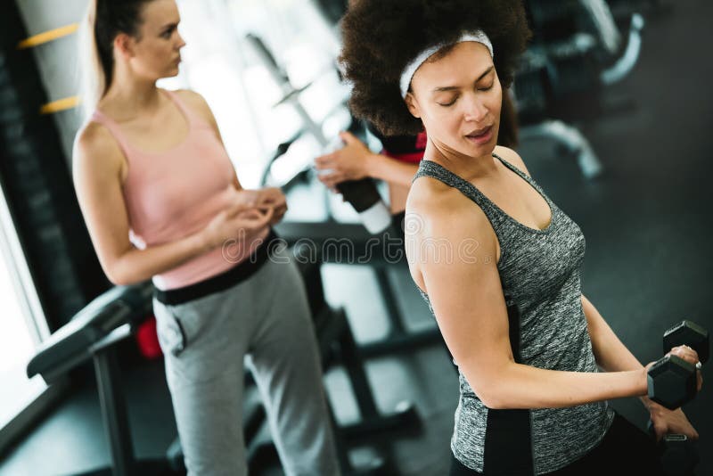 Group of Healthy Fit People at the Gym Exercising Stock Image - Image ...