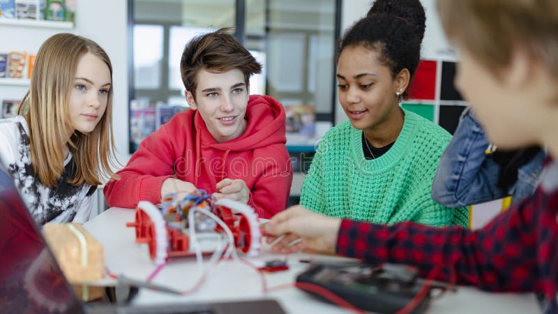 Group of High School Students Building and Programming Electric Toys ...
