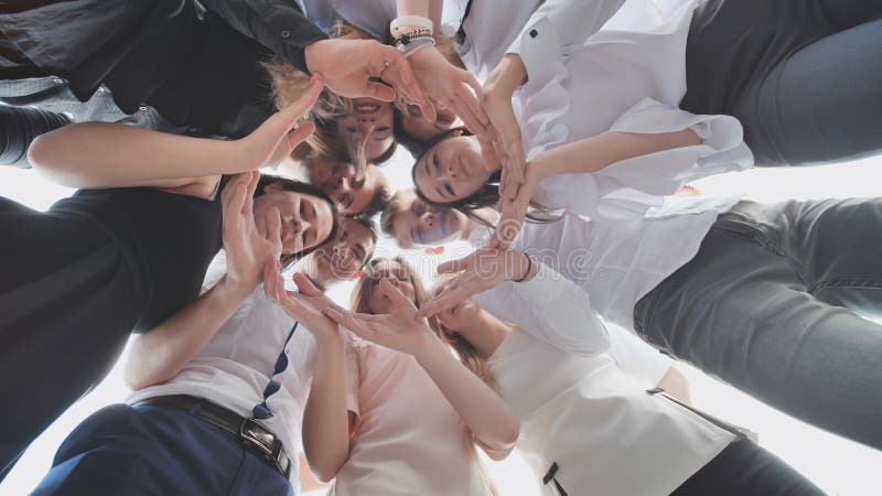 A Group of High School Students Look through the Shape of a Circle ...
