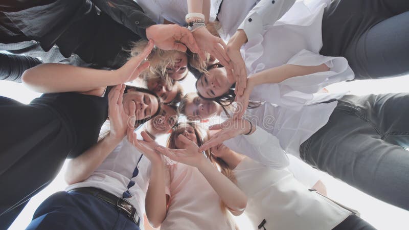 A Group of High School Students Look through the Shape of a Circle ...