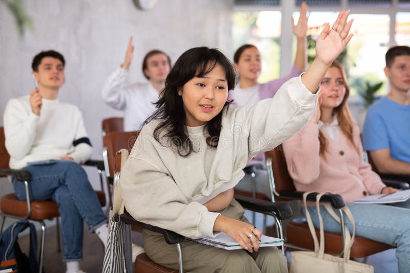 Group of High School Students Raising Hands in Auditorium Stock Image ...