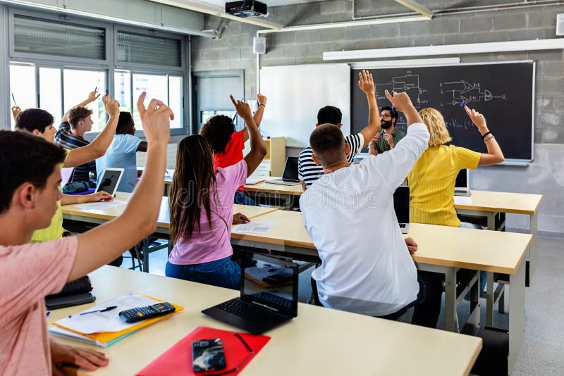 Group of High School Students Raising Hands in Classroom Stock Image ...
