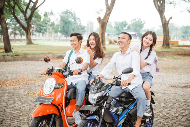 Group of High School Students Riding a Motorcycle without Helmet Stock ...
