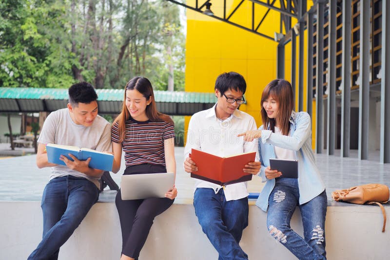 A Group of High School Students Sit Together To Study in the Area of ...
