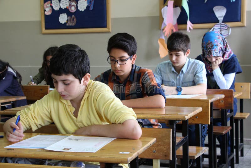 Group of High School Students Taking a Test in Classroom. Editorial ...