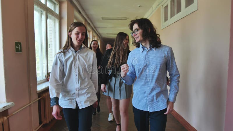 High School Students Enjoying Their Break Time, Walking and Chatting in the School Hallway Stock ...