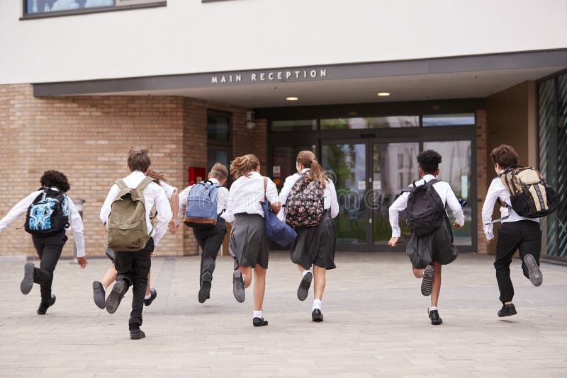 Group of High School Students Wearing Uniform Running into School ...