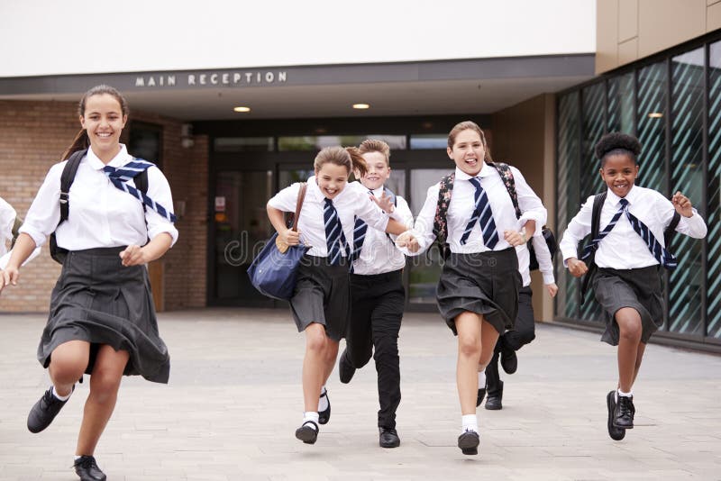 Group of High School Students Wearing Uniform Running Out of School ...