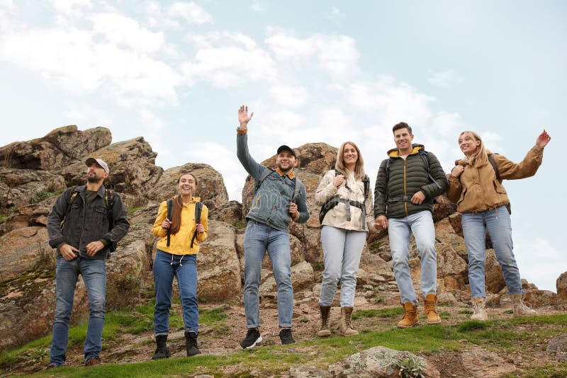 Group of Hikers with Backpacks in Mountains Stock Photo - Image of ...
