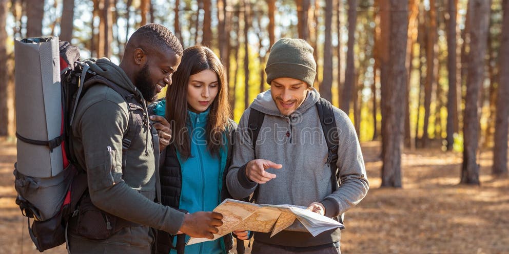 Group of Hikers Checking Map, Lost in Middle of Forest Stock Image ...