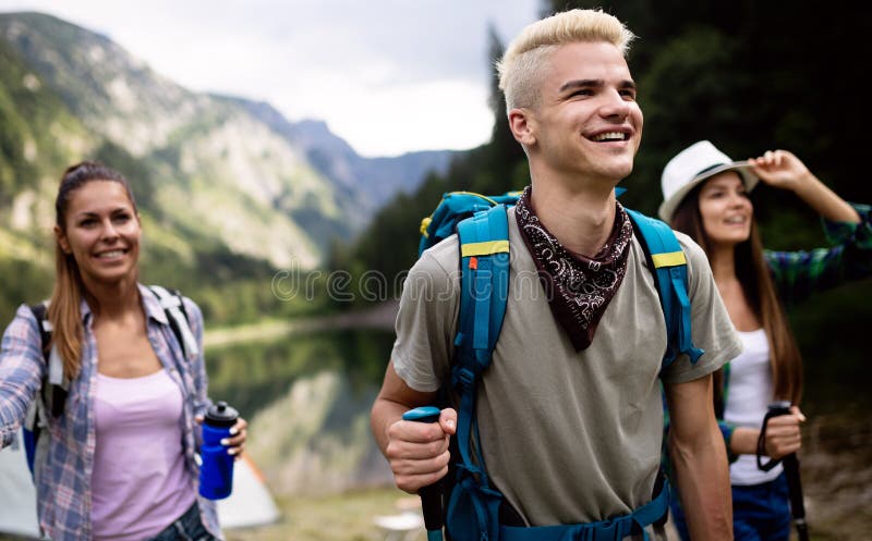 Group of Friends Hikers Walking on a Mountain at Sunset Stock Image ...