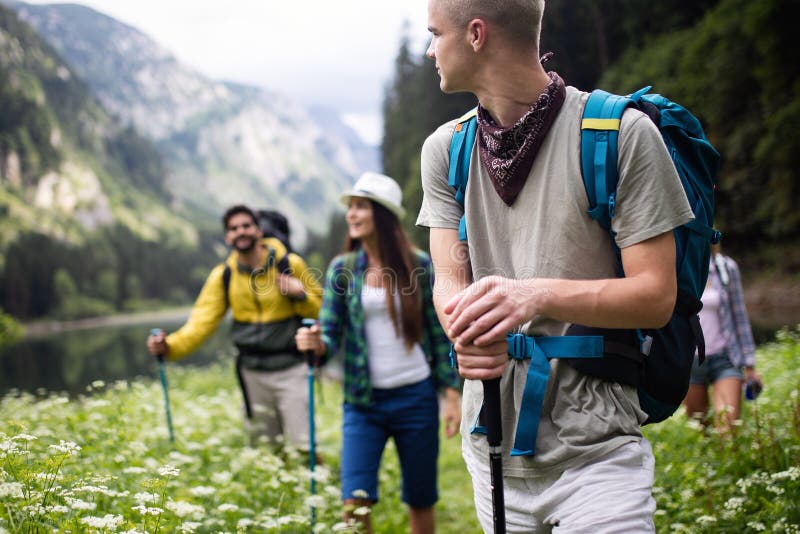 Group of Friends Hikers Walking on a Mountain at Sunset Stock Image ...