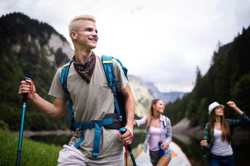 Group of Friends Hikers Walking on a Mountain at Sunset Stock Photo ...