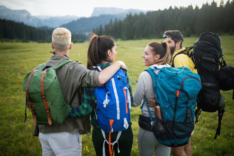 Group of Hikers Walking on a Mountain and Smiling Stock Image - Image ...