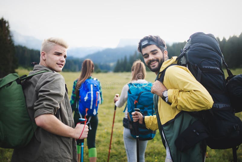 Group of Hikers Walking on a Mountain and Smiling Stock Photo - Image ...