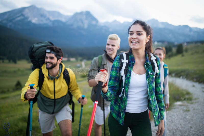 Group of Hikers Walking on a Mountain and Smiling Stock Photo - Image ...