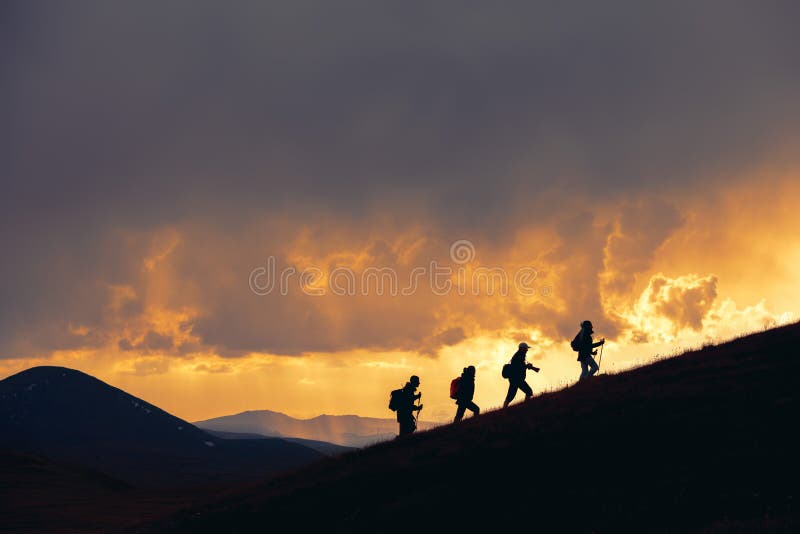 Group of Hikers Walks at Majestic Sunset in Mountains Stock Image ...