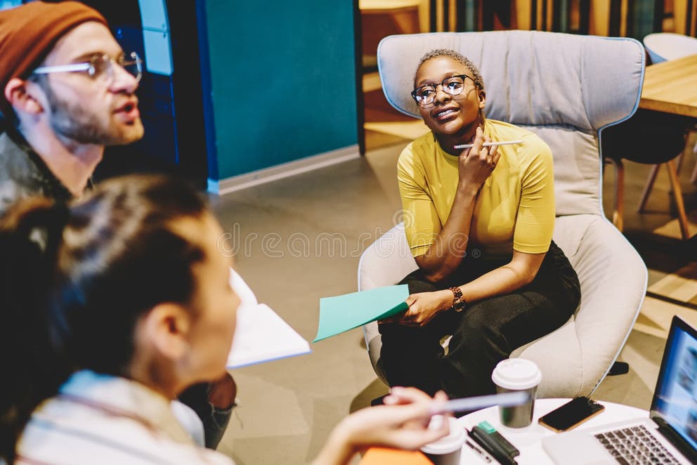 Group of Hipster Guys Discussing Ideas for Design Project Stock Photo ...