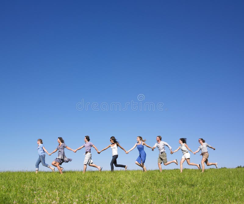 Group Holding Hands Running Stock Image - Image of playful, adult: 11009129