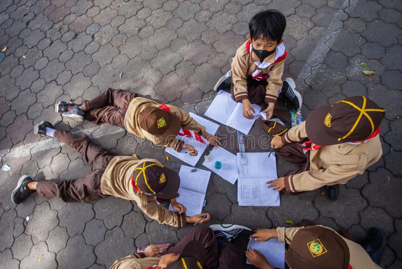 A Group of Indonesian Scouts are Working on Assignments Together ...