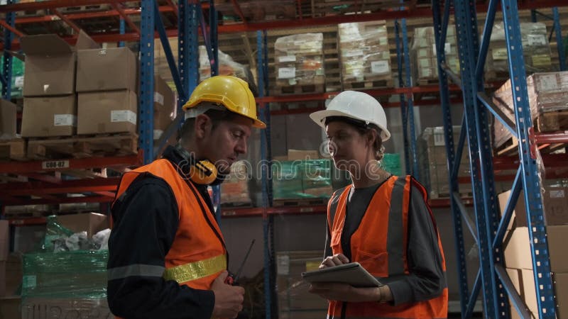 Group of Industrial Worker Working and Discuss in the Warehouse Stock ...