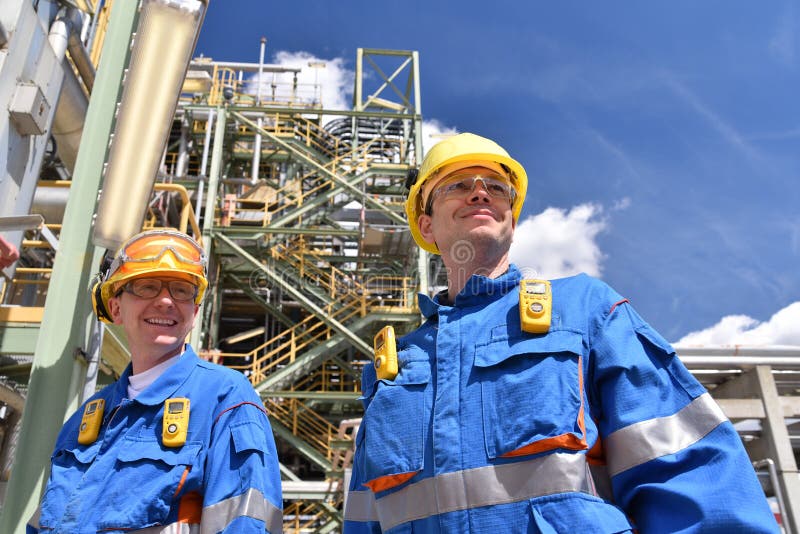 Chemical Industry Plant - Workers in Work Clothes in a Refinery with ...
