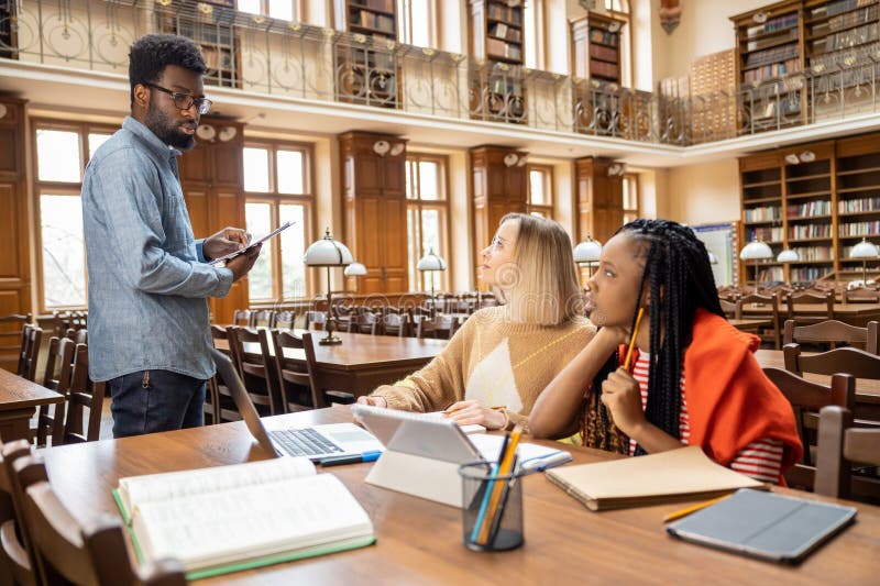 Group of International Students Working Together in the Library Stock ...