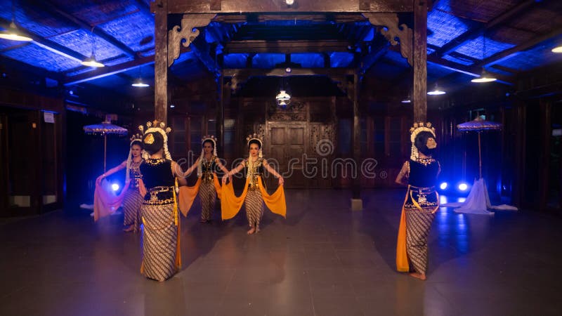 A Group of Javanese Dancers are Dancing a Traditional Dance in an Old ...