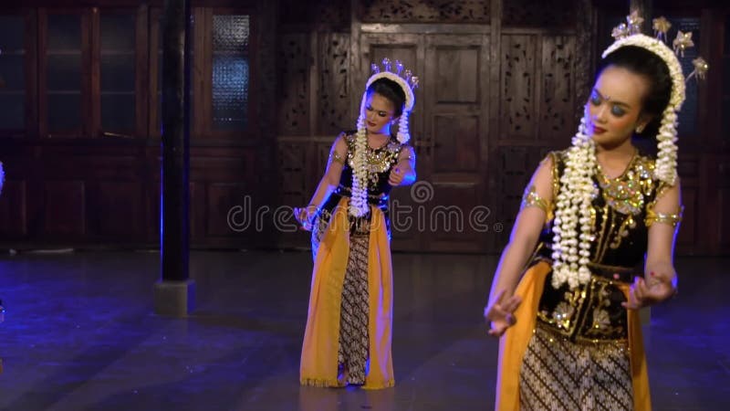 A Group of Javanese Dancers Performs a Traditional Dance in Front of ...