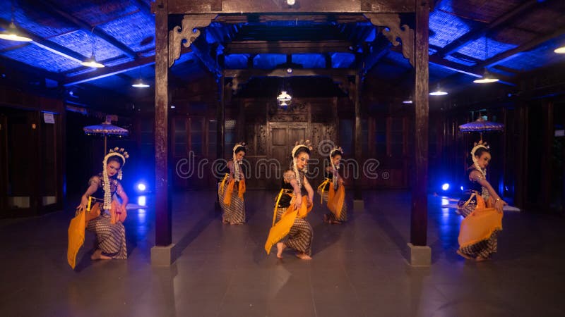 A Group of Javanese Dancers in Traditional Patterned Costumes Dance ...