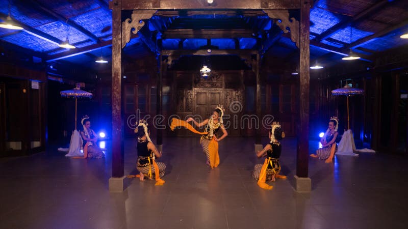 A Group of Javanese Dancers in Traditional Patterned Costumes Dance ...