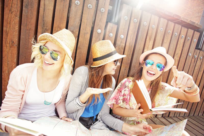 Group of Joyful Tourists Using Map in the City Stock Photo - Image of ...
