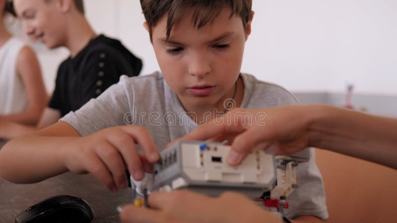 Group of Children are Making Robots from the Constructor in School of ...
