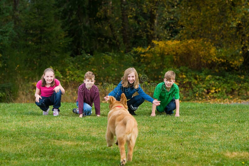 A Group of Kids Calling Their Dog To Them. Stock Image - Image of kids ...