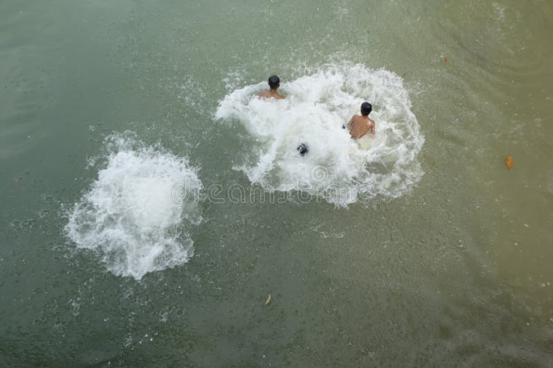 Kids Having Fun and Jumping Off the Dock into a River. Editorial Stock ...
