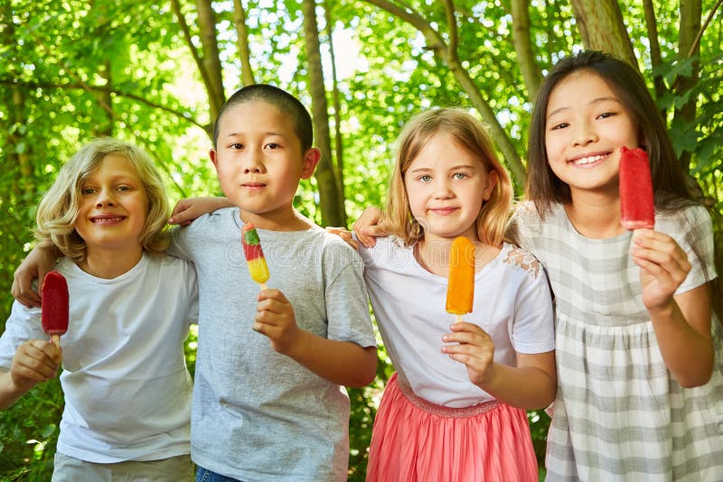 Group of Kids Having Ice Cream in Summer Stock Photo - Image of ...