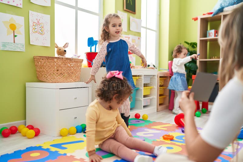 Group of Kids Having Lesson Sitting on Floor at Kindergarten Stock ...