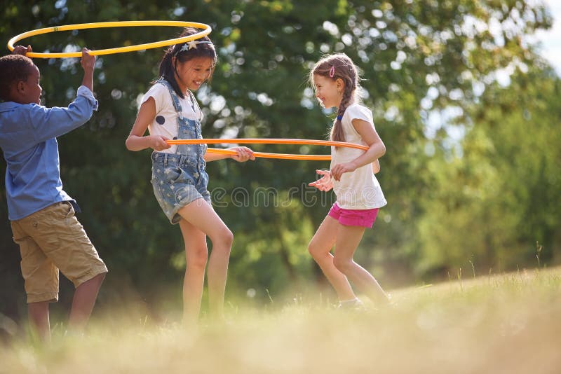 Group of Kids with Hula Hoop Stock Image - Image of round, young: 70257737