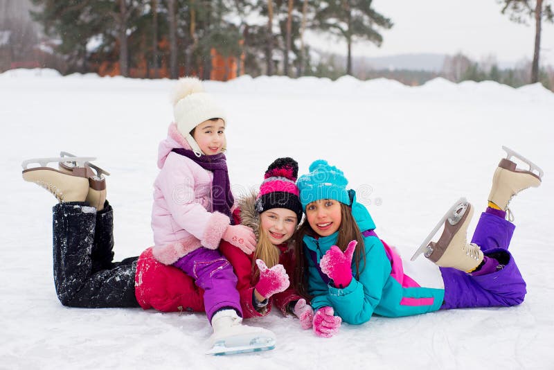Group of Kids Lying on the Ice Stock Photo - Image of cold, gloves ...