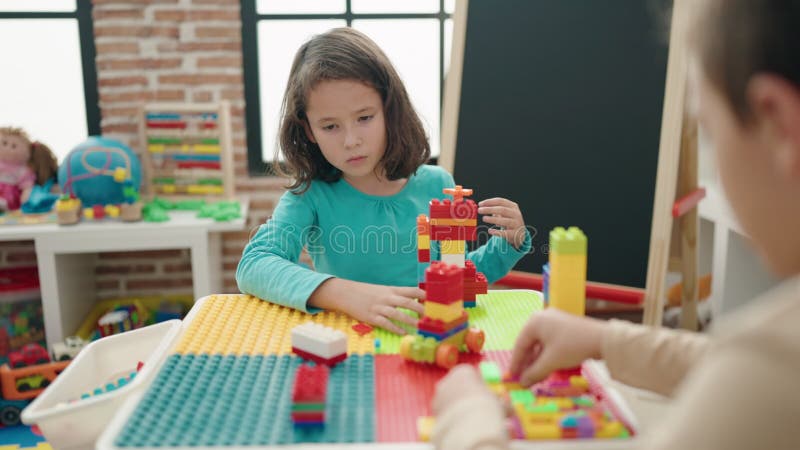 Group of Kids Playing with Construction Blocks Sitting on Table at ...