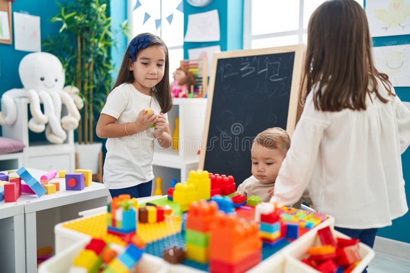 Group of Kids Playing with Construction Blocks Standing at Kindergarten ...