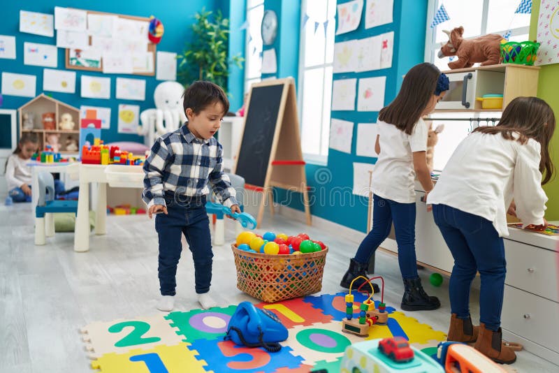 Group of Kids Playing with Toys Standing at Kindergarten Stock Image ...