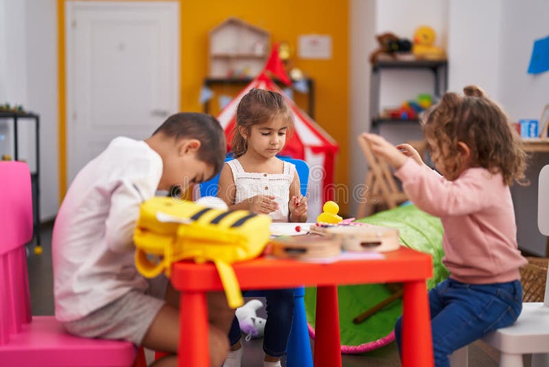 Group of Kids Preschool Students Sitting on Table Drawing on Paper at ...