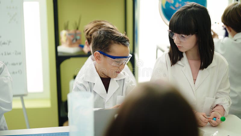 Group of Kids Scientists Students Using Laptop Holding Molecules at ...