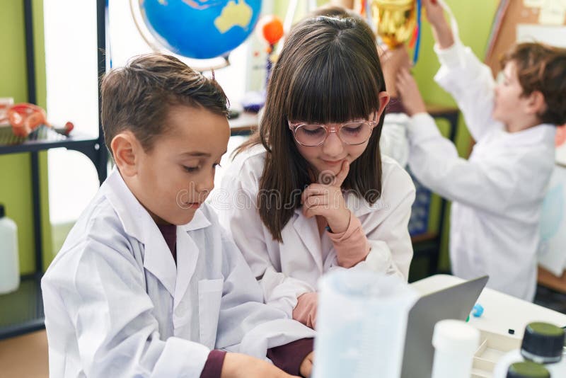 Group of Kids Scientists Students Using Laptop at Laboratory Classroom ...