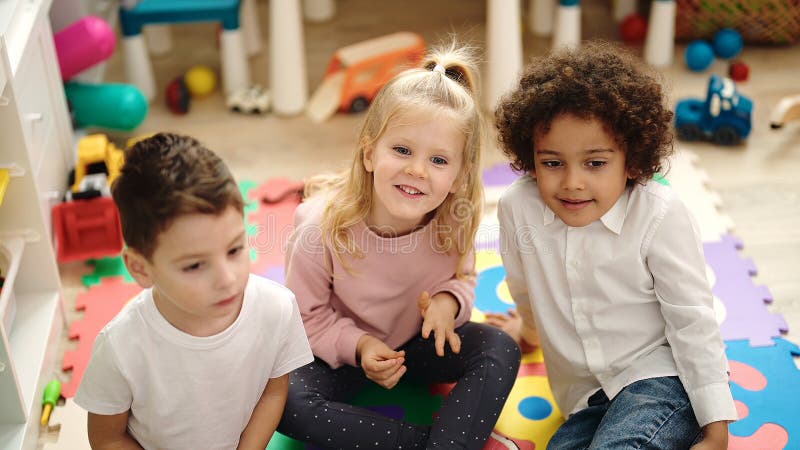 Group of Kids Sitting on Floor Smiling Confident at Kindergarten Stock ...